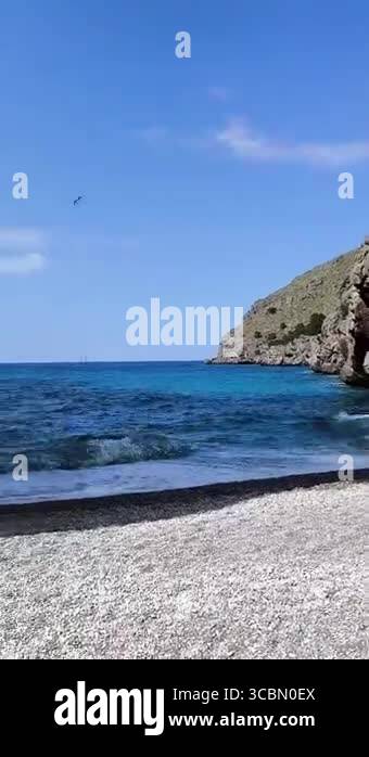 A stunning shot of a hidden cove with crystal clear turquoise water and ...