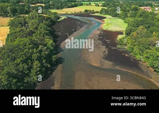Aerial View Panning Up Of Hamble River Downstream In Summer Low Tide ...