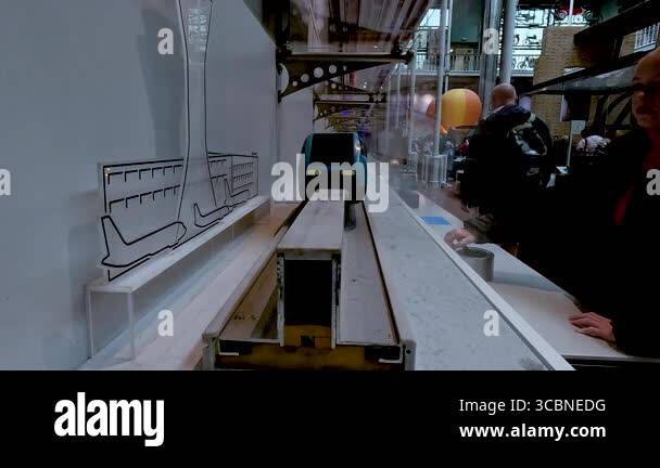 Visitors engage with a dynamic museum display Stock Video Footage - Alamy