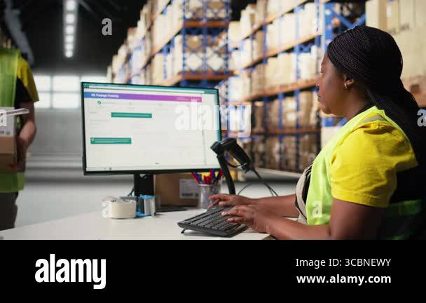Staff member managing barcodes awb scanning tasks for online shopping ...