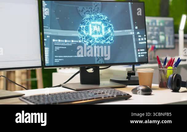 Close up of PC screen on startup office desk showing artificial intelligence programming ...