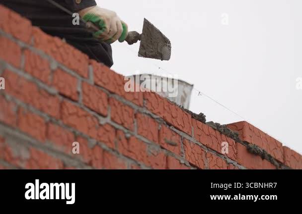 Construction mason builds brick Stock Videos & Footage - HD and 4K ...