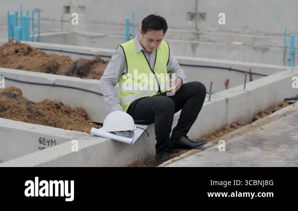 Construction concept of 4k resolution. Asian engineer resting after ...