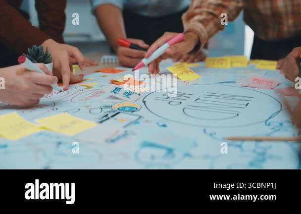 A dynamic scene of diverse people collaborating in a workshop ...