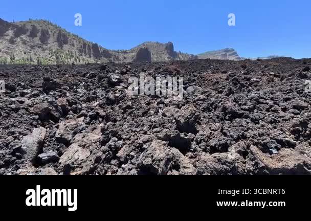 A breathtaking panoramic view of rugged volcanic terrain featuring ...
