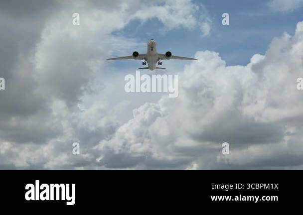 Airplane flying over camera in cloudy sky Stock Video Footage - Alamy