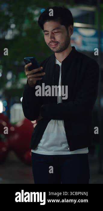 Calm male person in casual outfit standing on relaxed pose with hand on ...