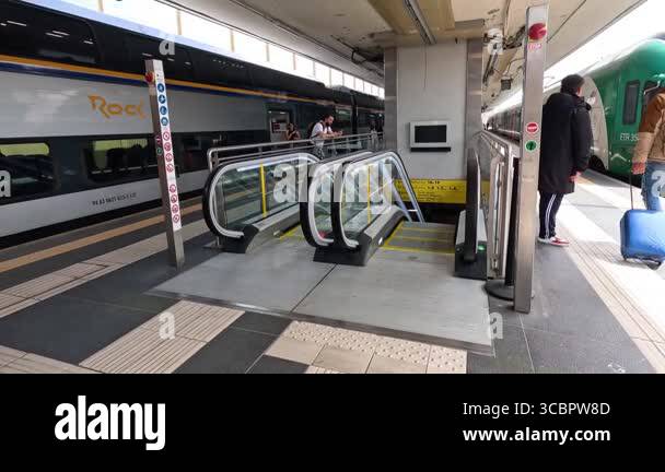 People boarding exiting trains station Stock Videos & Footage - HD and ...