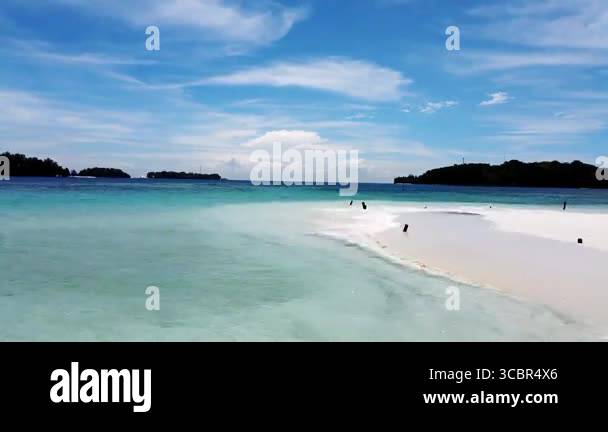 The beach is a tranquil haven, where rhythmic waves gently caress the ...