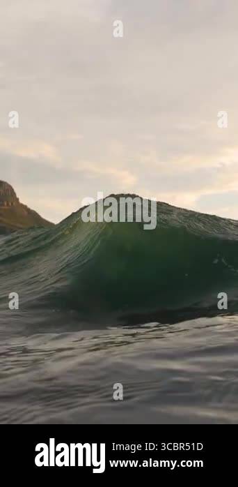 Ocean waves are a mesmerizing sight, their turquoise waters rising and ...