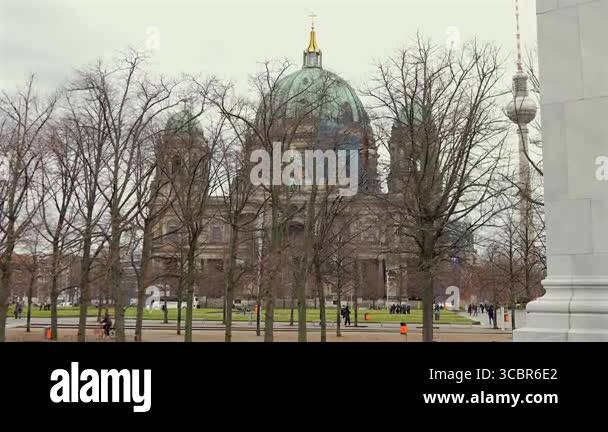 Berlin Cathedral seen through leafless winter trees, showcasing its ...