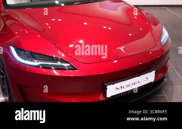Front view of a red Tesla Model 3 in a Berlin showroom on May 28 2025 ...