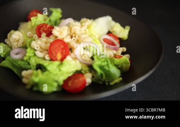 Pasta salad green leaf lettuce, tomato, pasta, onion fresh delicious ...