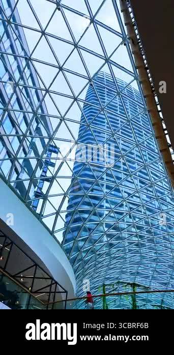 Modern urban glass design. Intricate glass structure showcases a blend ...
