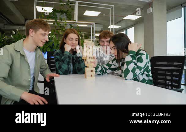 Caucasian young adults students are enjoying their leisure time playing ...