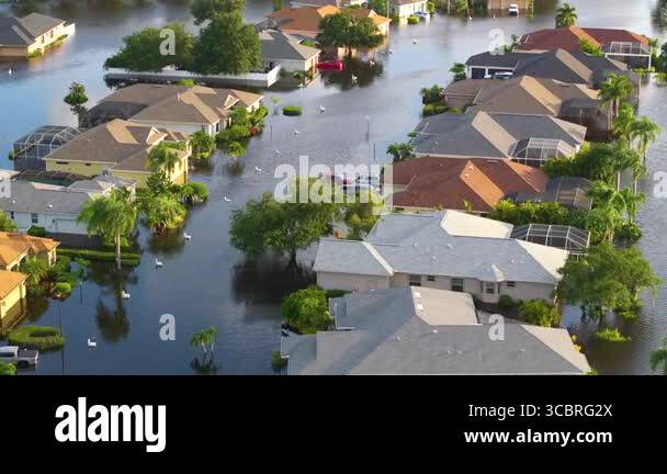 Flooded houses and cars from hurricane rainfall water in Florida ...