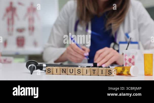 Word Sinusitis built from wooden blocks put near ENT tools and medicine ...