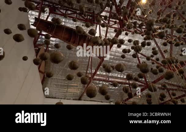 A detailed model of a cluster bomb is displayed in a museum, showcasing ...