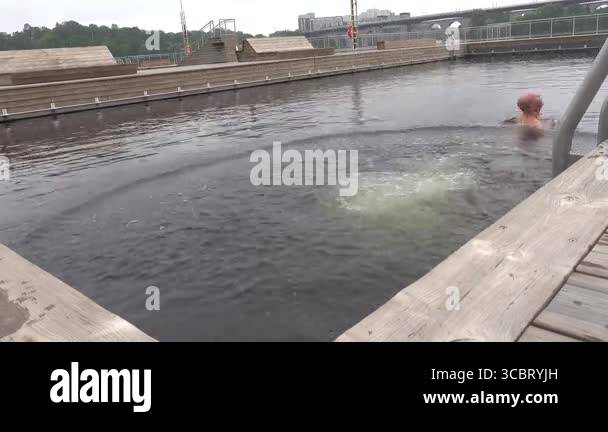 Stockholm, Sweden A man swims at the new Marieviksbadet public and free ...