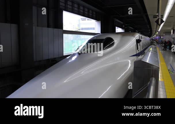 Bullet train pulls into and leaves the station Stock Video Footage - Alamy