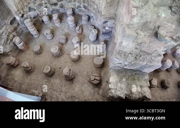 Hypocaust heating system with brick pilae supporting the floor in the ...