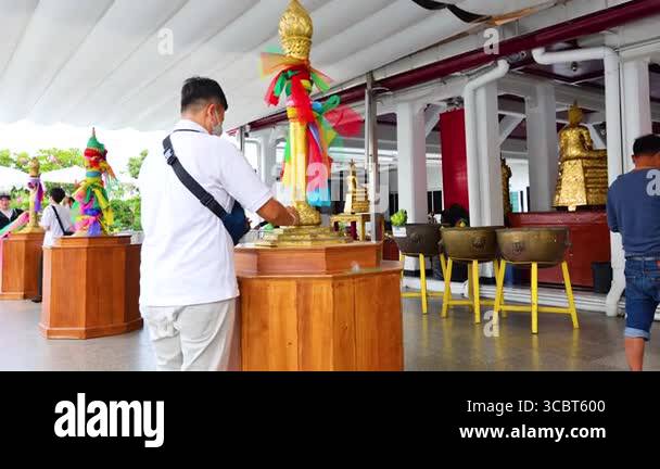 A man performs a traditional ritual at the City Pillar Shrine in ...