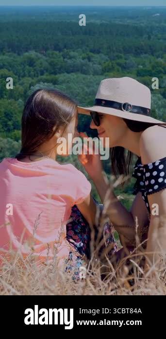 Beautiful summer landscape. woman and little girl, mom and daughter ...