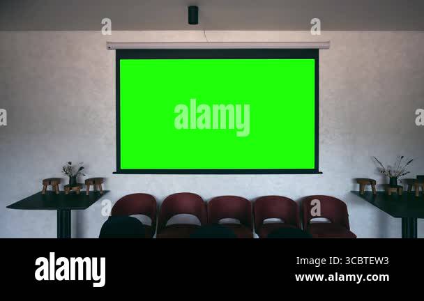 The conference room wall has a green projection screen that is isolated ...