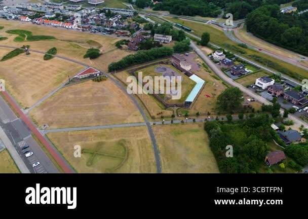 Aerial view of a historic military fort with grass-covered bunkers ...