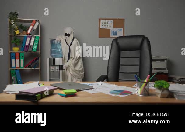 Person dressed as ghost day at work. Halloween businessman ghost in ...