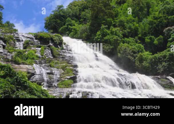 The nature of the waterfall in the forest that flows strongly during ...