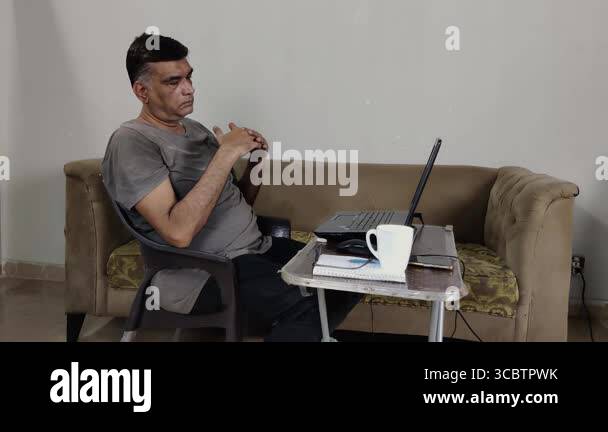 Man Intensely Watching Laptop and Pressing Hands Together in Silence at ...