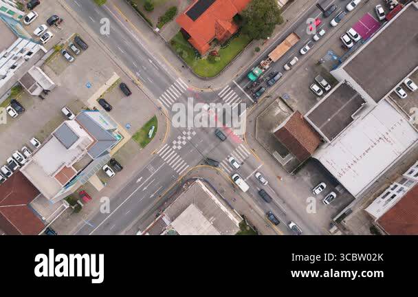 Aerial view of busy urban intersections with crosswalks and red ...
