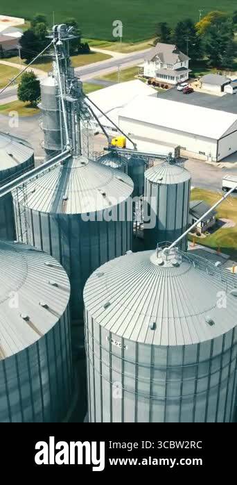 Aerial view of metal silos for grain storage. Modern grain storage plant, grain storage tanks ...