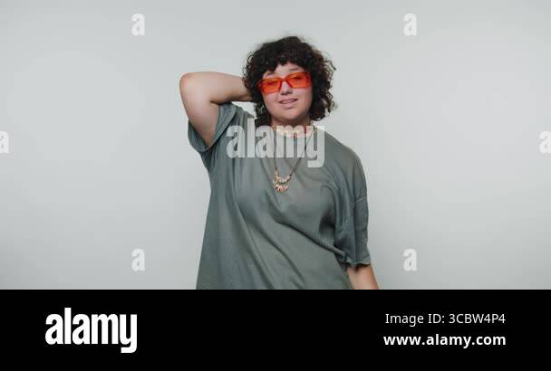 pose of frustration by young woman in neon sunglasses highlights ...