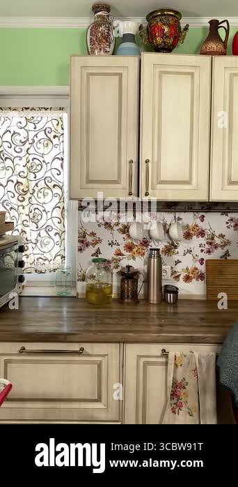 Young woman doing household chores at home, staying productive and ...