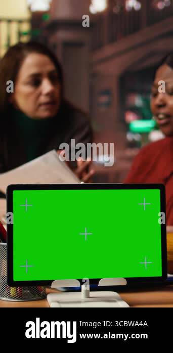 Vertical Video Actors team rehearsing together in a library next to isolated copy space ...