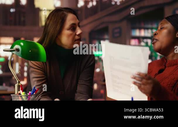 Diverse actors rehearsing dialogue and character expression in a quiet ...