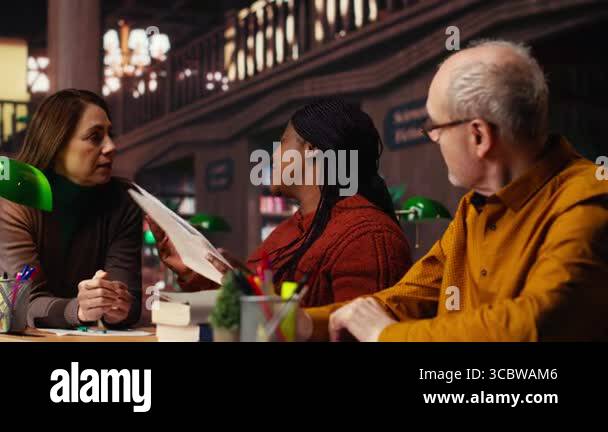 Diverse actors practicing theatre script with deep dedication in a ...