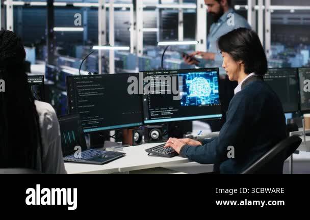 Delighted team in data center celebrating finishing neural network software development ...