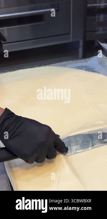 the process of making desserts in pastry shops working with dough black ...