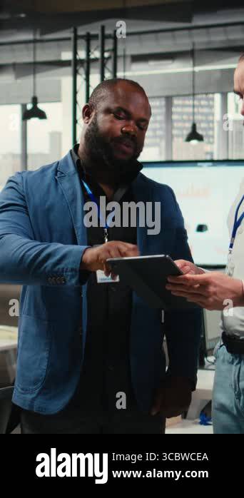 Vertical Video Businessmen analysts monitoring efficiency insights at ...