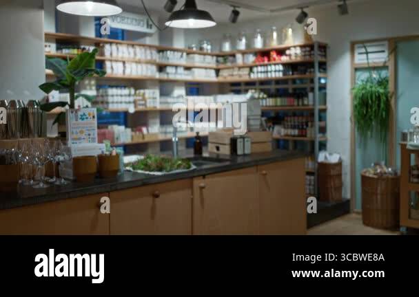 Defocused view of a stylish indoor shop with elegant display shelves ...