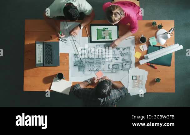 Time lapse of architect engineer working together while hand out ...