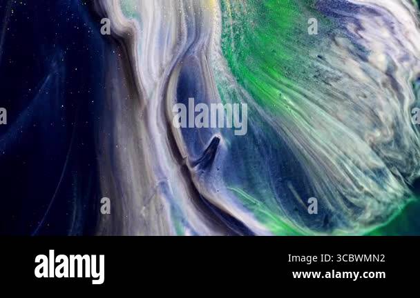 The dynamic swirling colors of blue and green come together to create ...