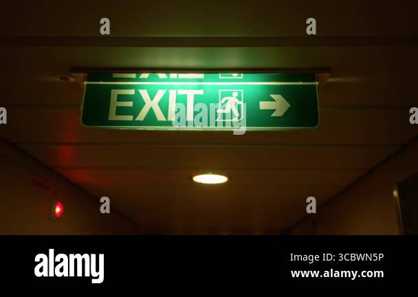 Green lit emergency exit sign Stock Videos & Footage - HD and 4K Video ...