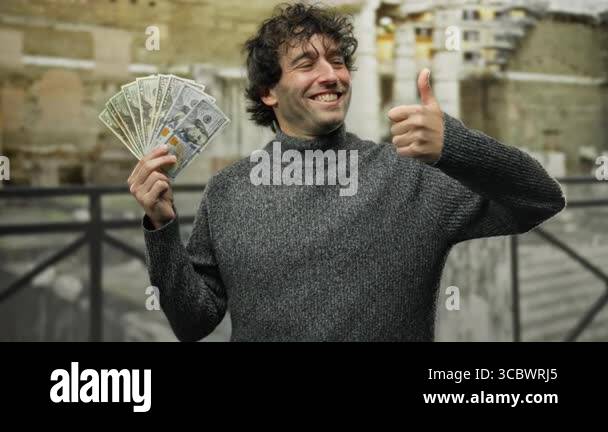 Hispanic man holding american dollars performs varied gestures among ...