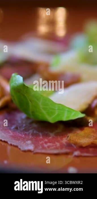 Delicious traditional gourmet beef carpaccio with parmesan cheese ...