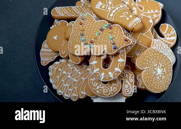 Gingerbread cookies with icing on a plate. Christmas sweet food ...