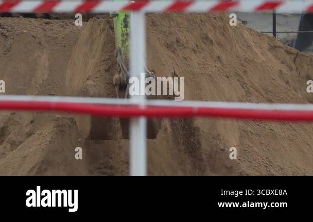 ALMATY, KAZAKHSTAN - OCTOBER 17 2024: Bucket of excavator takes soil ...
